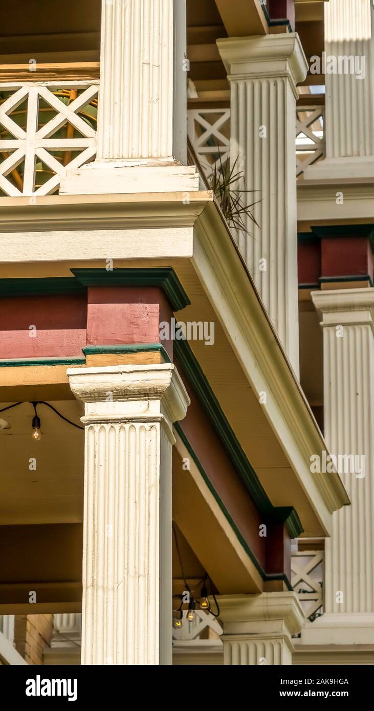 Vertical Close up of square columns and lattice railing framing the ...