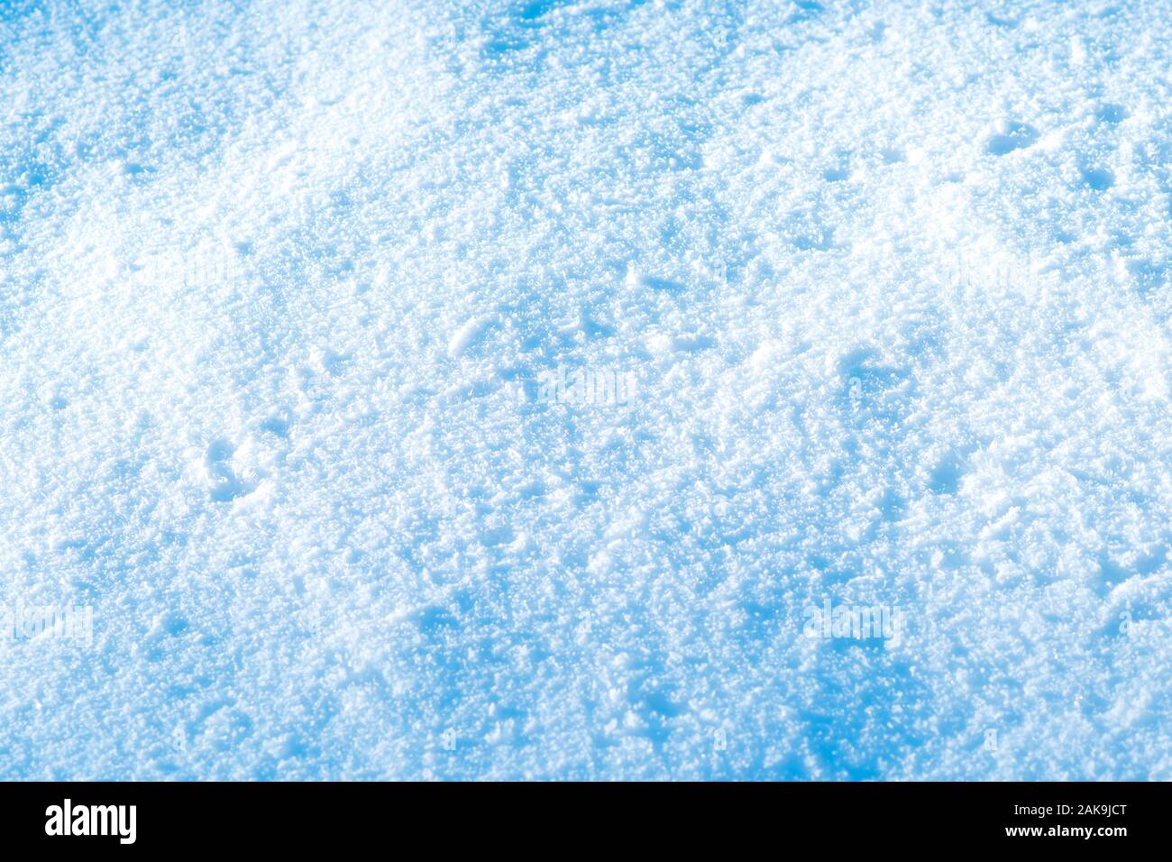 Shiny snow crystal with blue background hi-res stock photography and ...