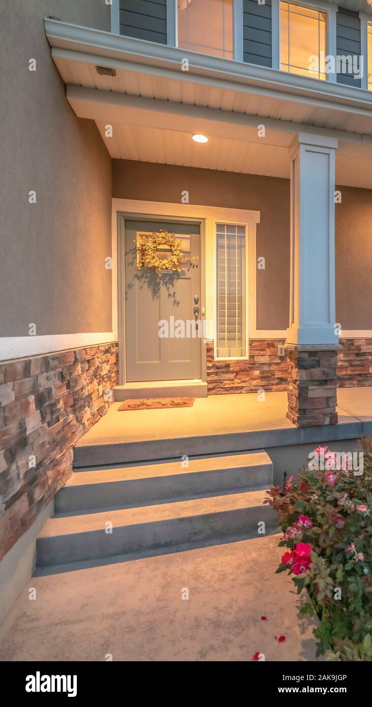 Vertical frame Home entrance with pathway and stairs leading to porch ...