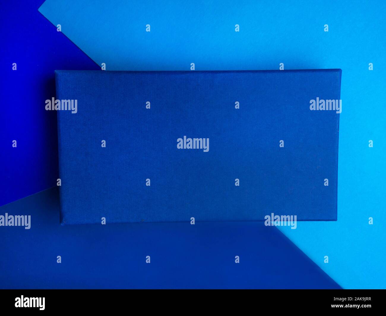different blue paper geometric shapes made of paper, gift blue box ...