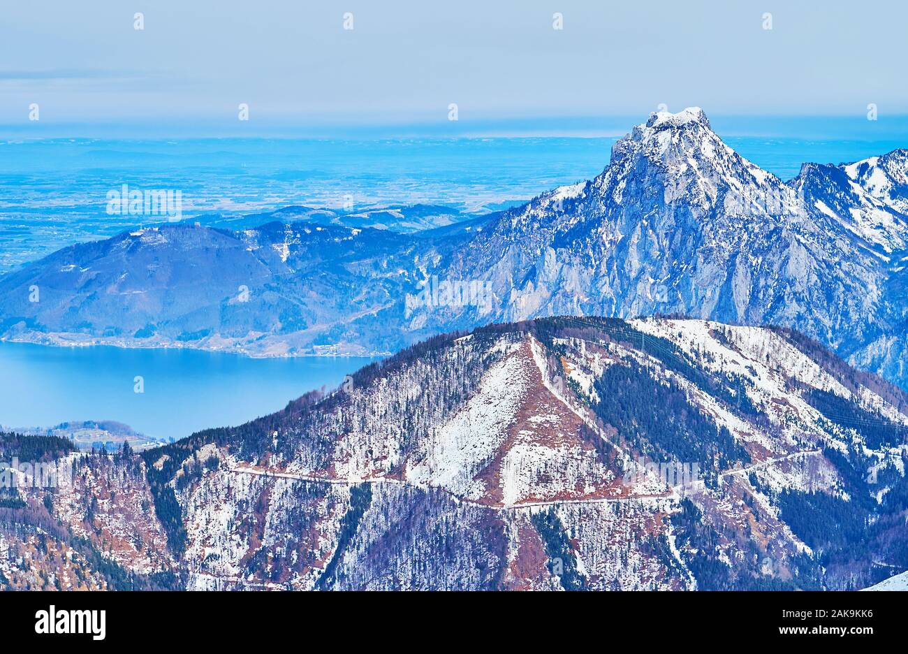The snowy sharp peak of Traunstein mount with steep rocky slopes and ...