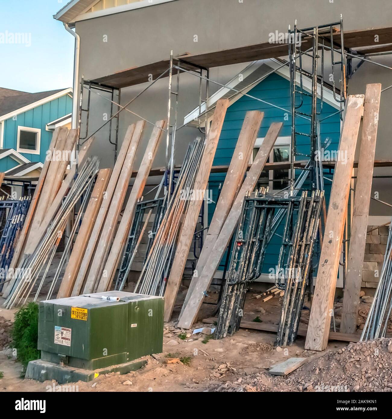 Square Residential construction with scaffolding and wooden beams ...