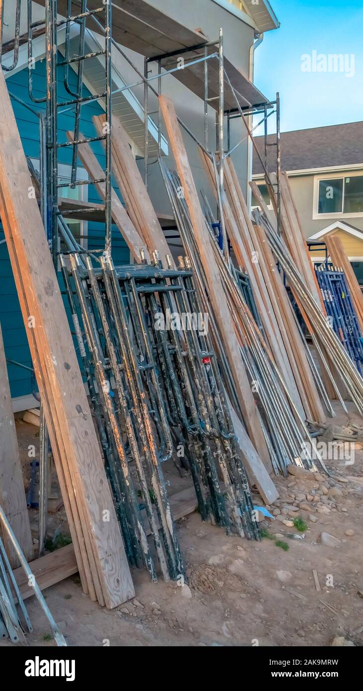 Vertical frame Construction materials and scaffolding against brick and ...