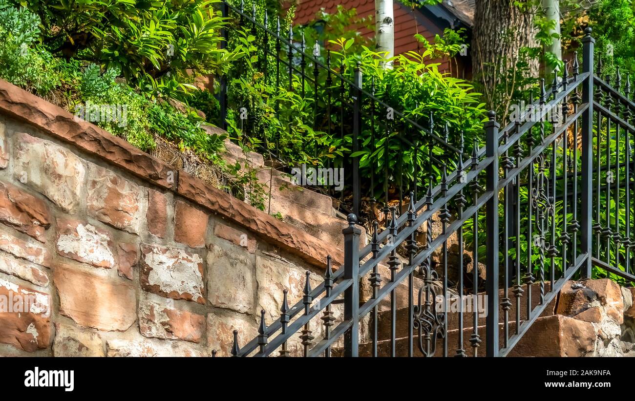 Pano frame Outdoor staircase with stone steps and black metal railing ...