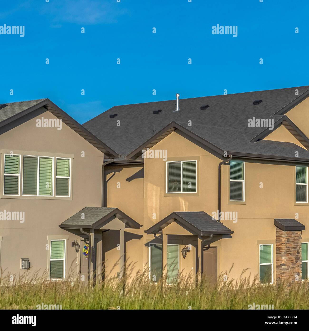 Square Exterior view of multi storey homes with balconies and porticos ...