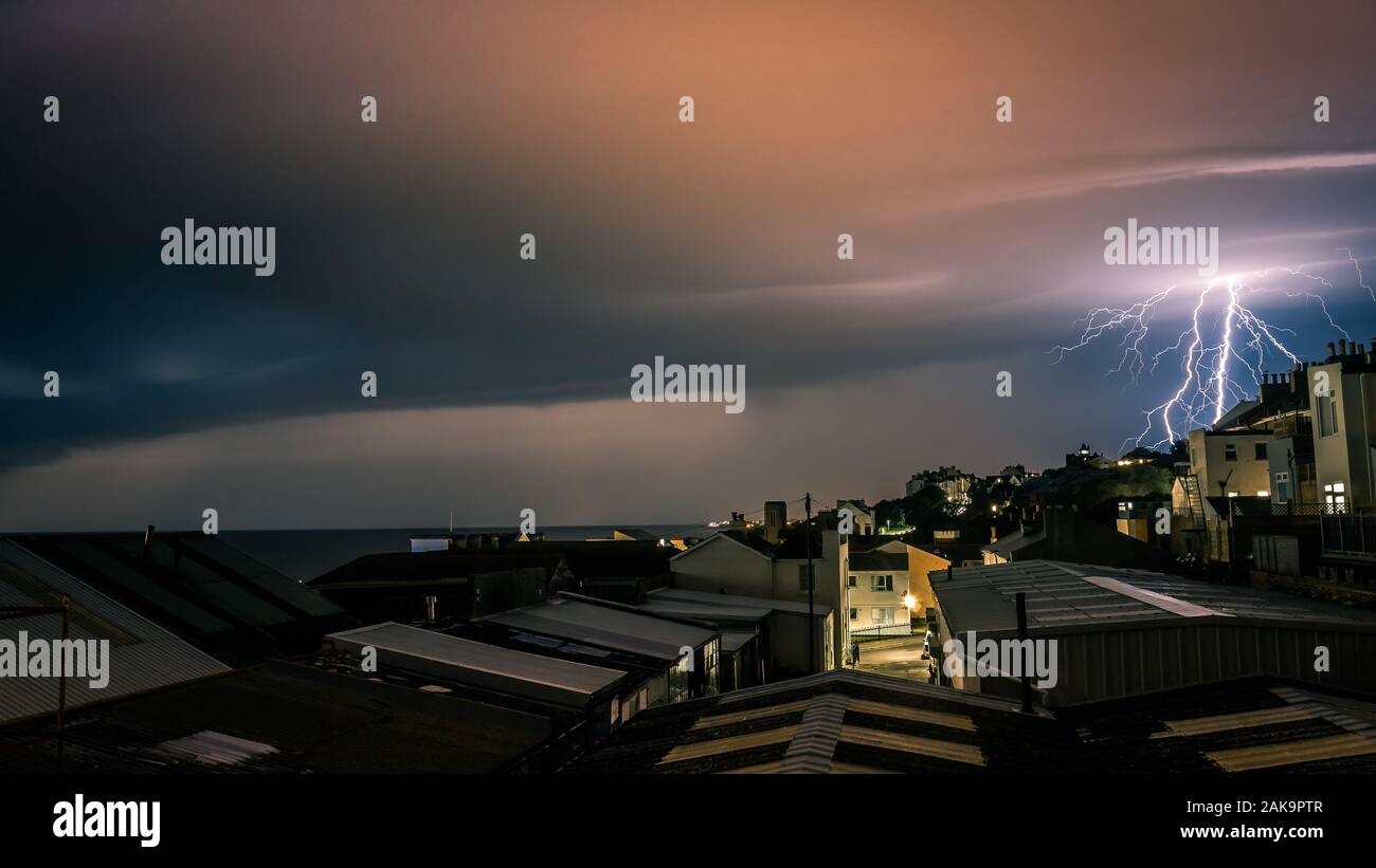 Powerful Lightning Strike Over Buildings Stock Photo - Alamy