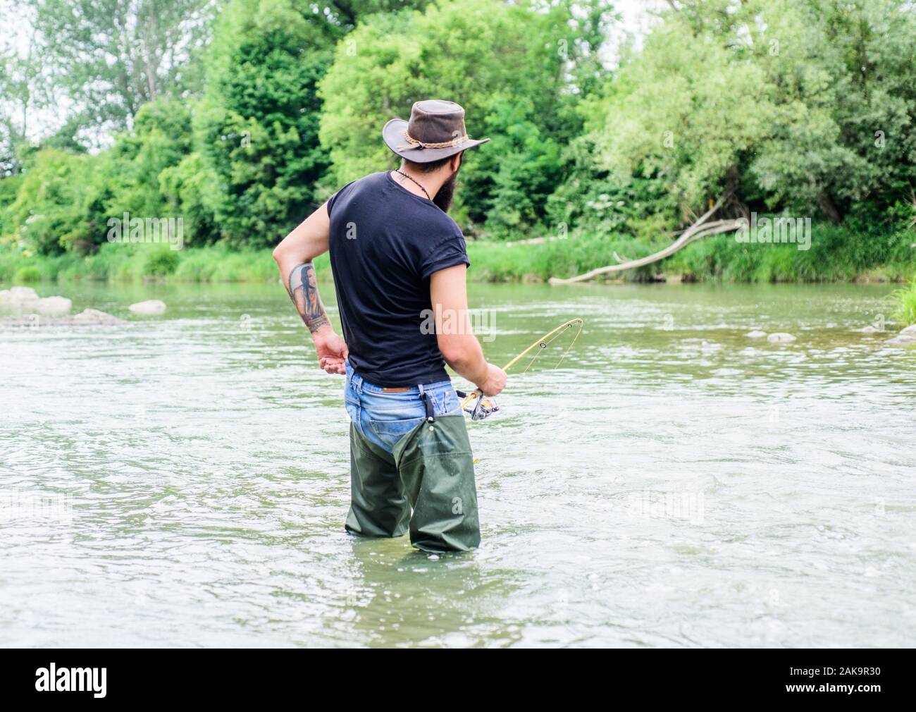 Catch A Trophy Fishing. fisherman with fishing rod. summer weekend. Big ...
