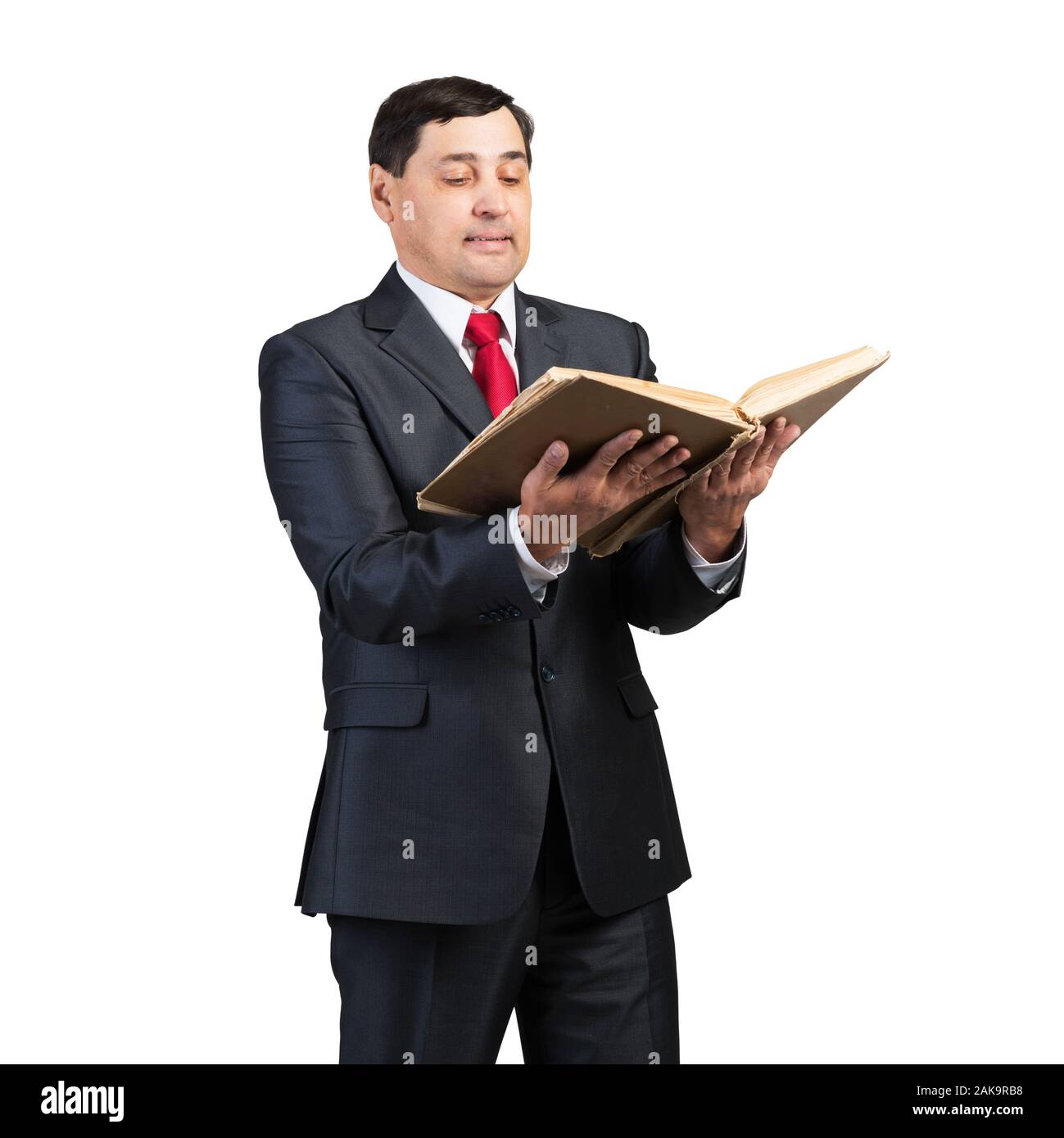 Senior businessman looking in open book Stock Photo - Alamy