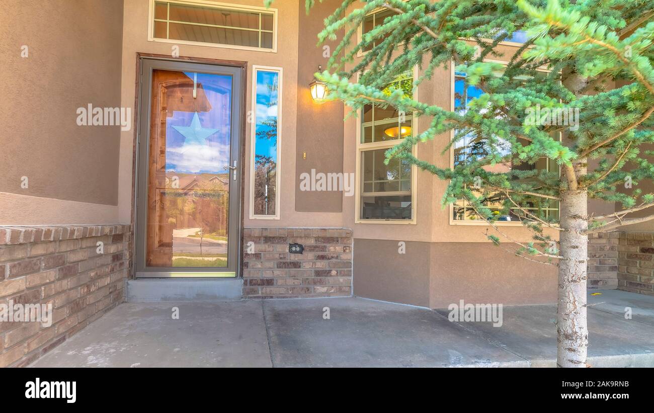 Pano Home with bay window and glass paned door with sidelight and ...