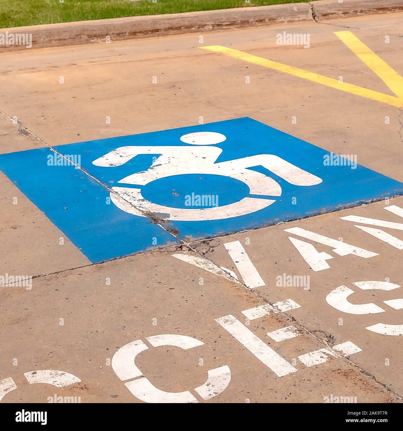 Square frame Handicapped parking lot with painted handicap symbol and ...