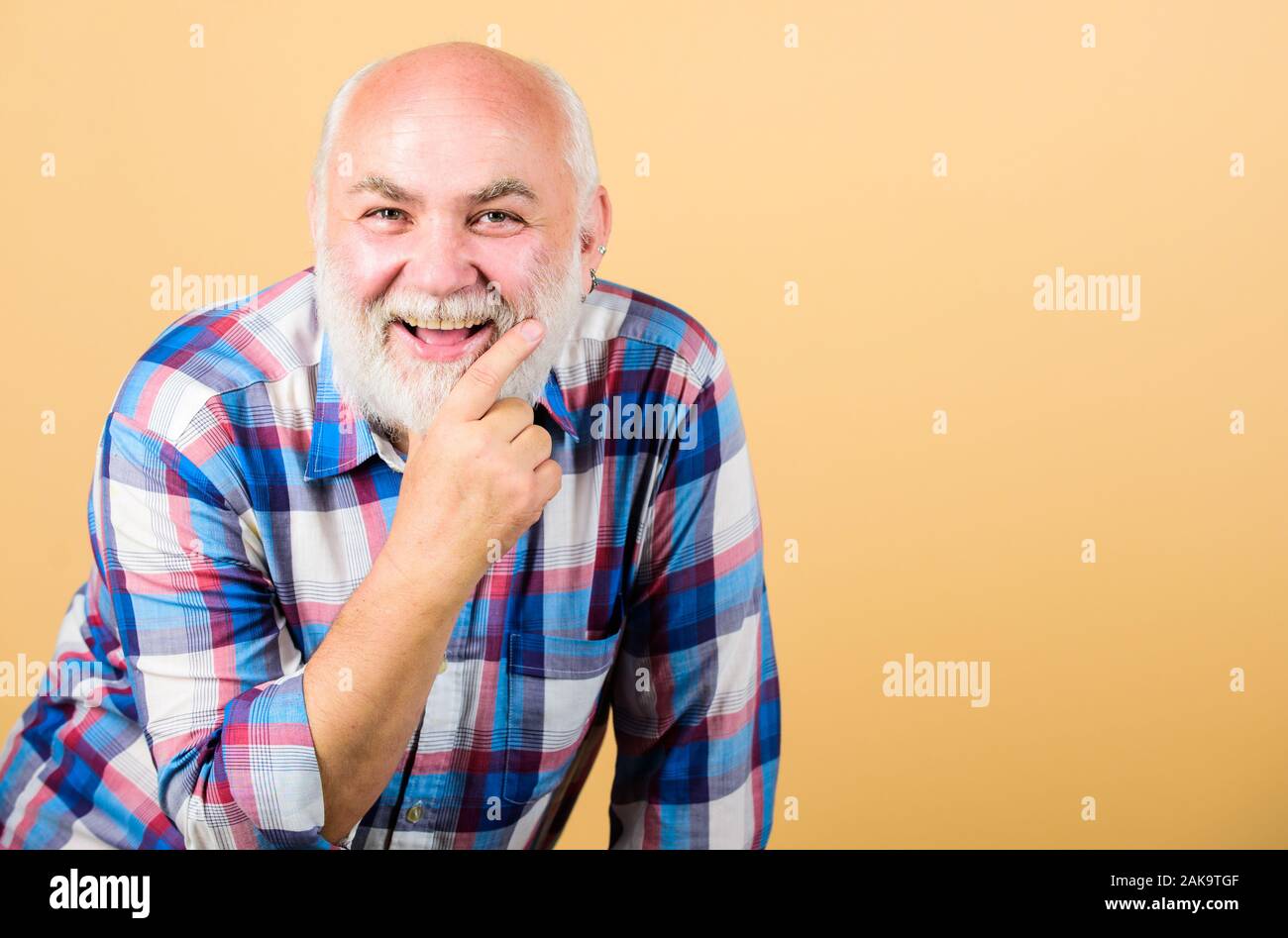 mature bearded man in checkered shirt. positive emotions. happy old ...