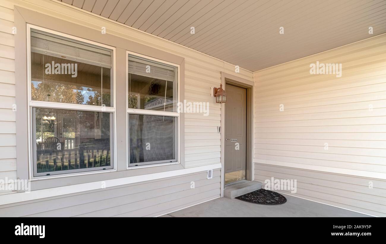 Panorama frame Covered entrance porch and door to a house Stock Photo ...