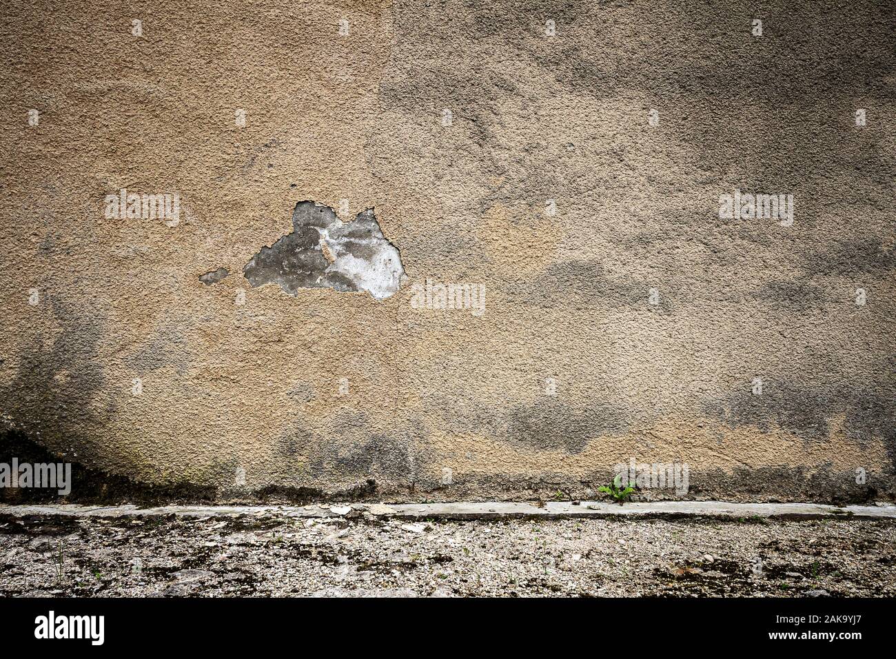Old weathered wall of plaster and a ground Stock Photo - Alamy
