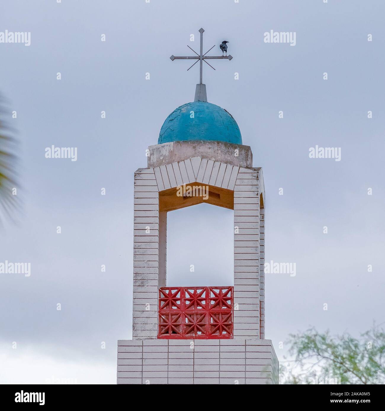 Square Bell tower of a small church above trees Stock Photo - Alamy