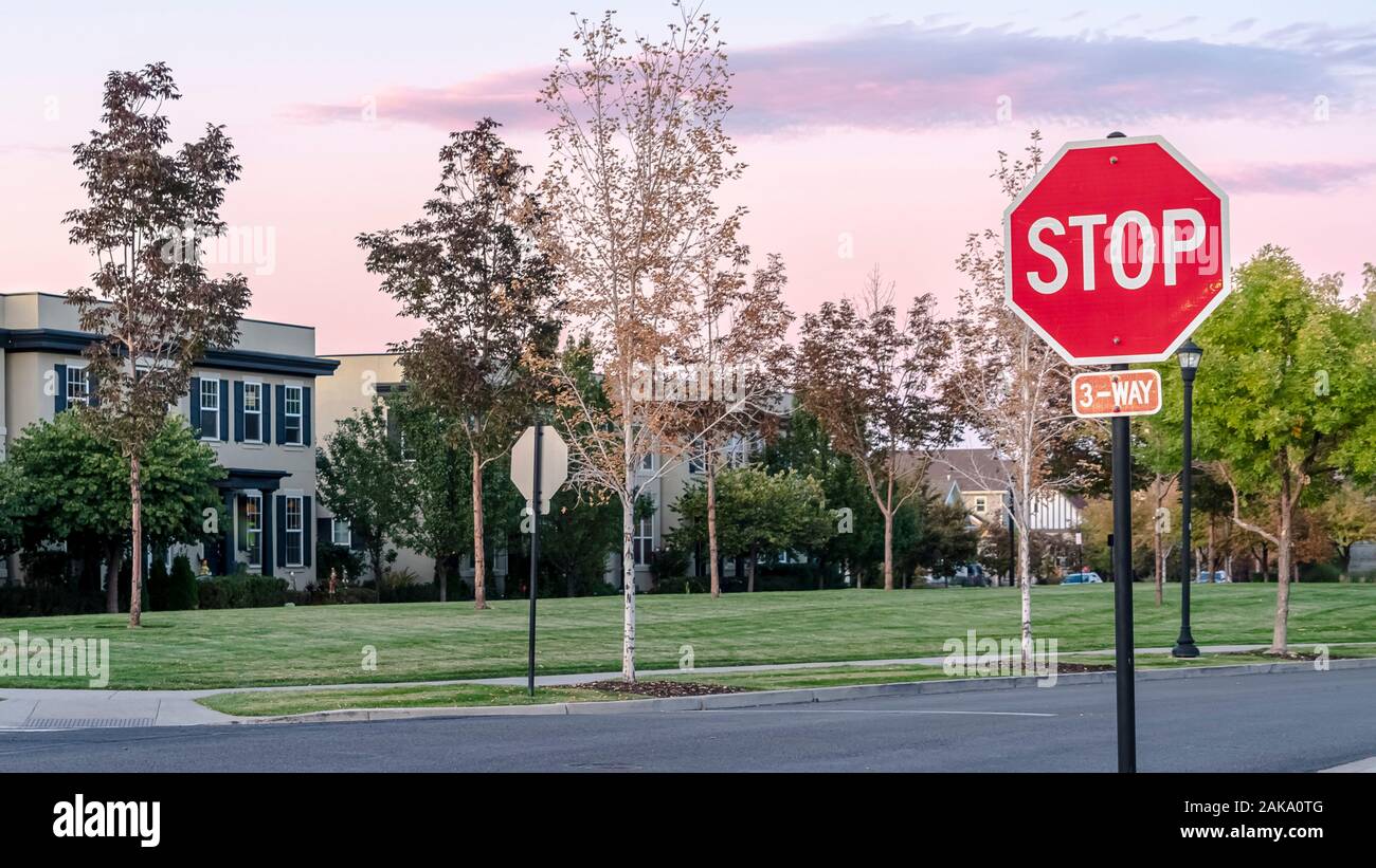 Panorama frame Stop sign at a street intersection at sunset Stock Photo ...