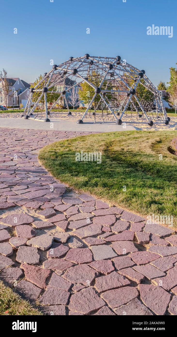 Vertical Curved path with crazy paving in a park Stock Photo - Alamy