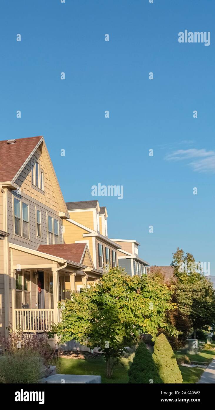 Vertical frame Row of urban houses with front porches Stock Photo - Alamy