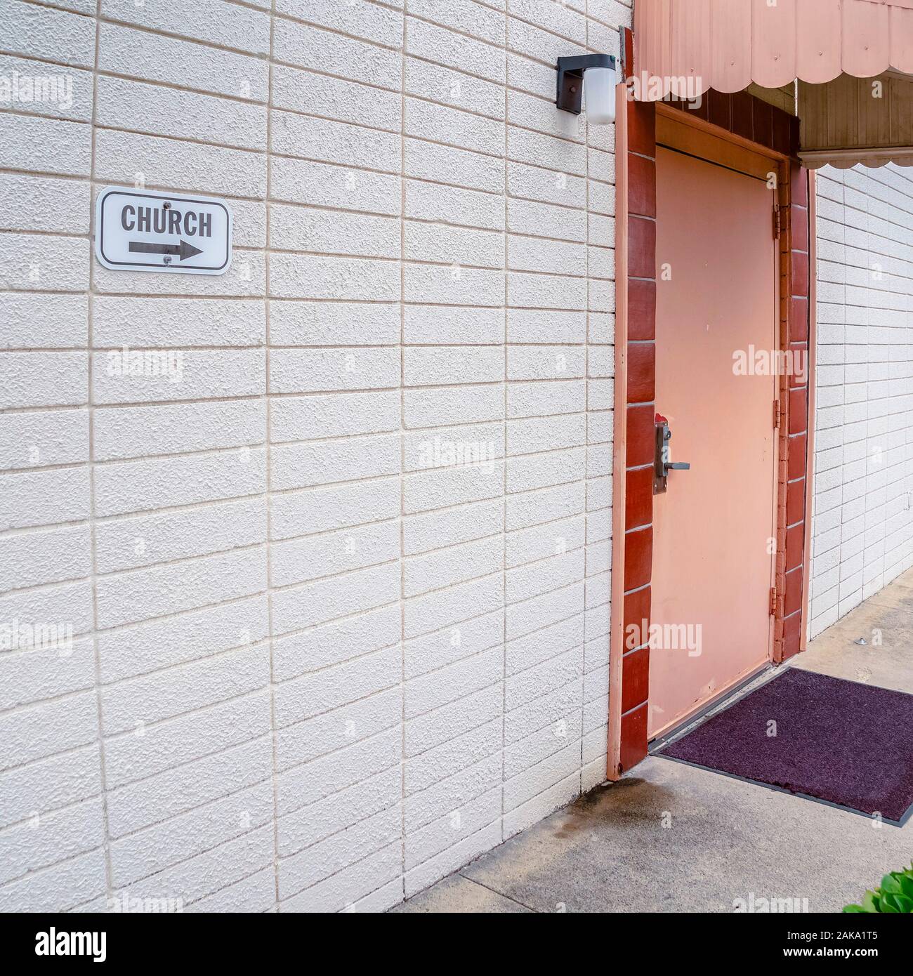 Square frame Covered entrance door in a modern white building Stock ...