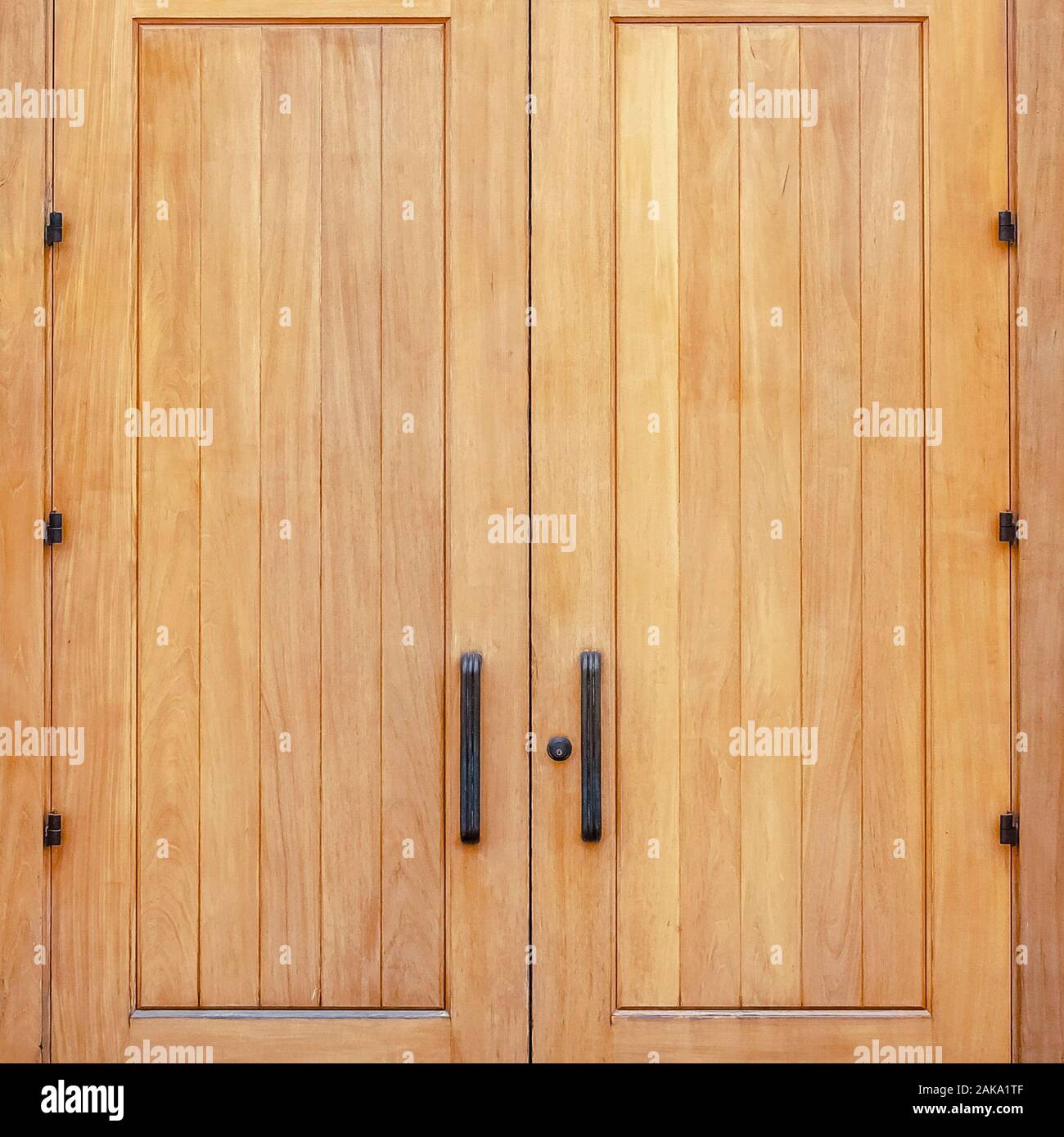 Square frame Double arched wooden entrance door of exterior Stock Photo ...