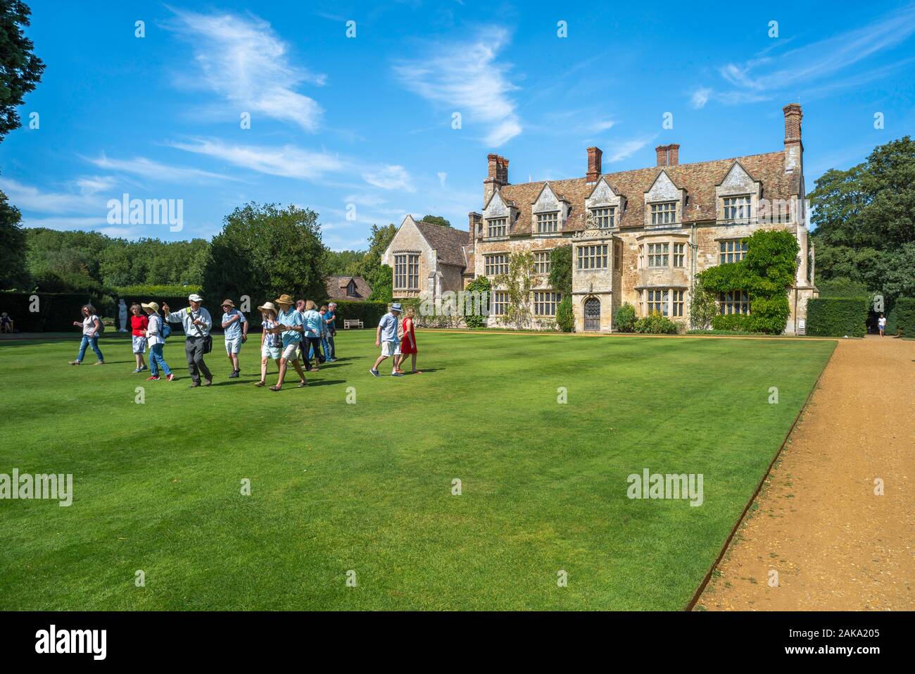 Anglesey Abbey, view of the lawn and south front of Anglesey Abbey, a ...