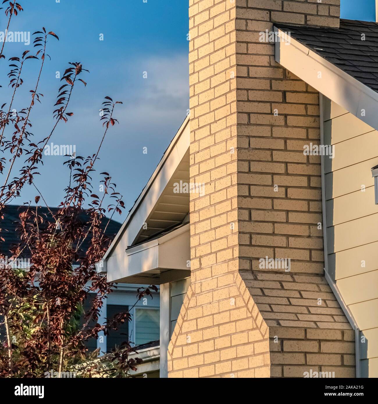 Square frame Feature brick chimney on a house exterior Stock Photo - Alamy