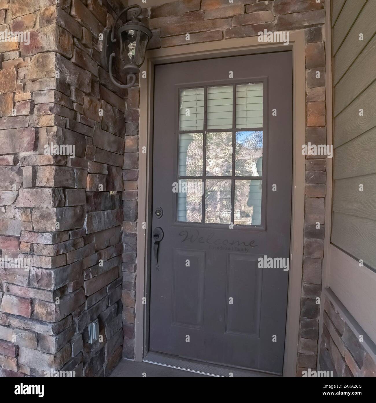 Square frame Entrance door to a house with feature brick wall Stock ...