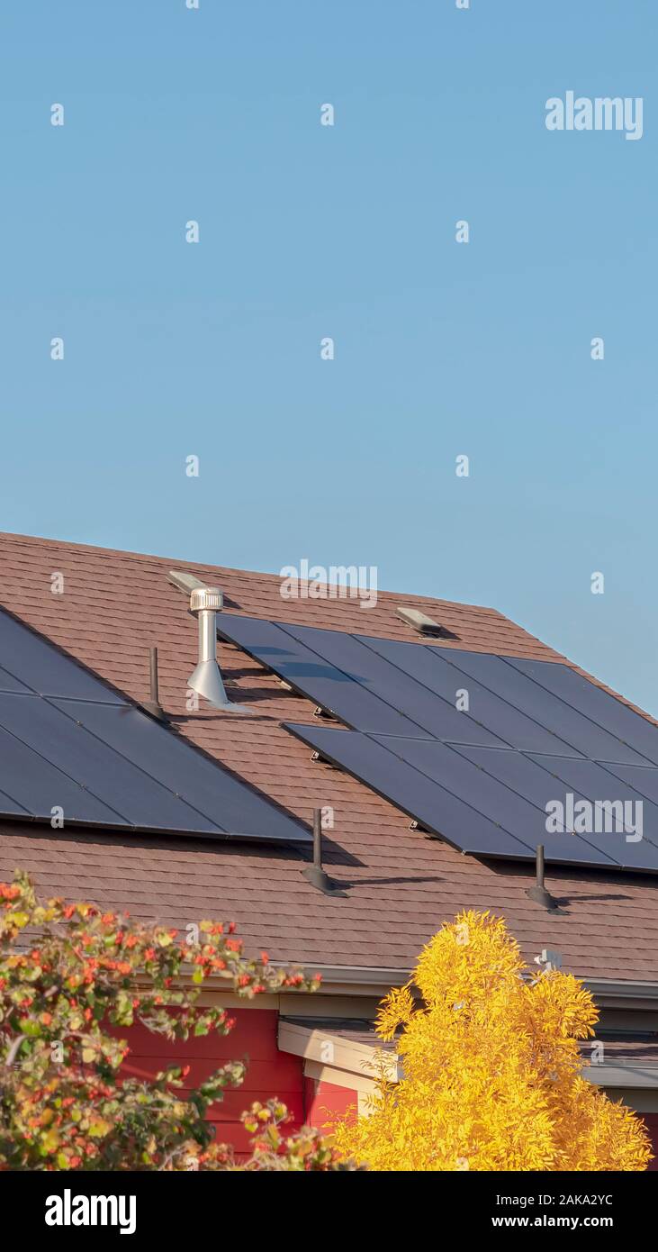 Vertical frame Photovoltaic solar panels on a house roof Stock Photo ...