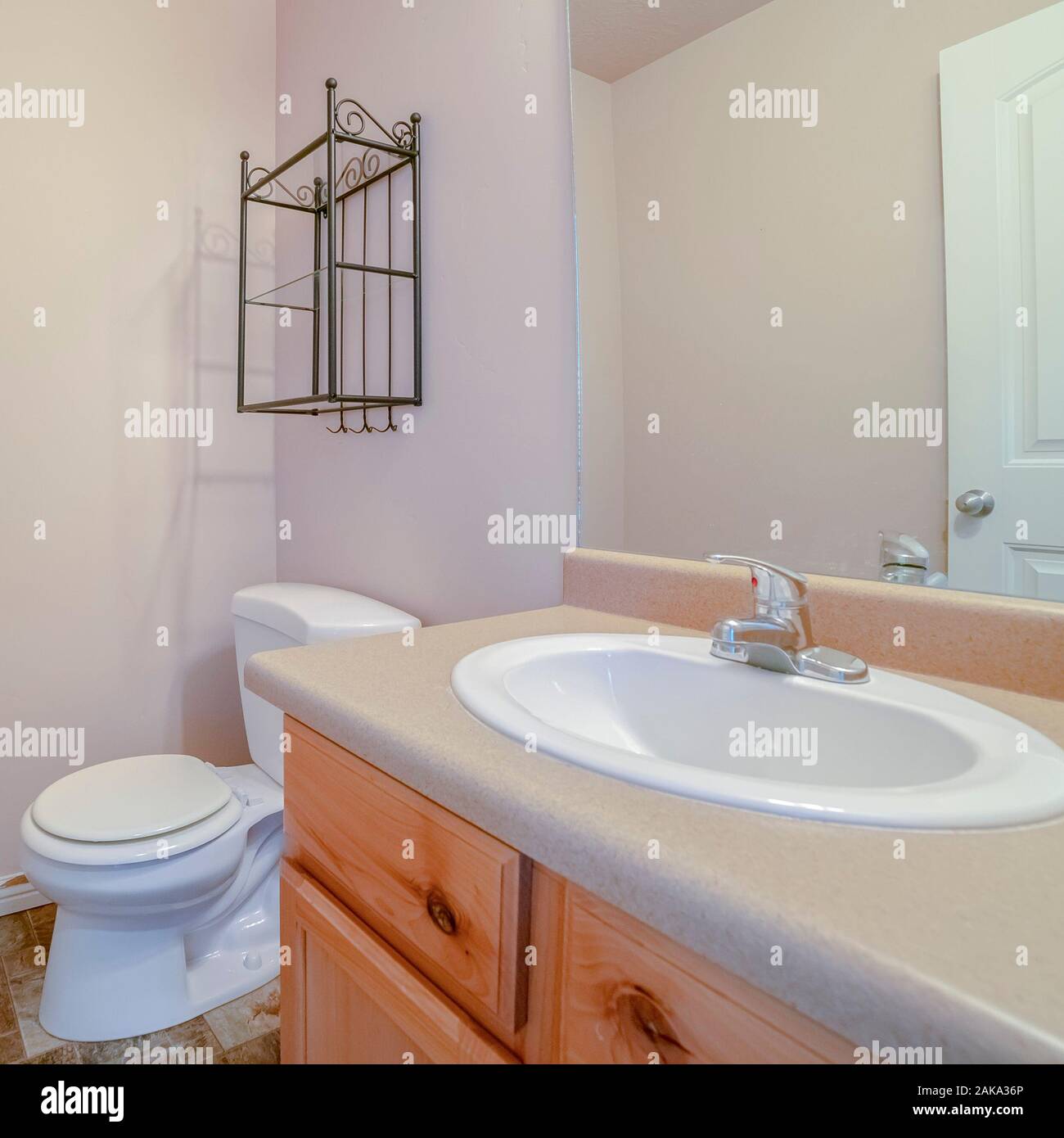 Square Interior of a bathroom with toilet and sink Stock Photo - Alamy