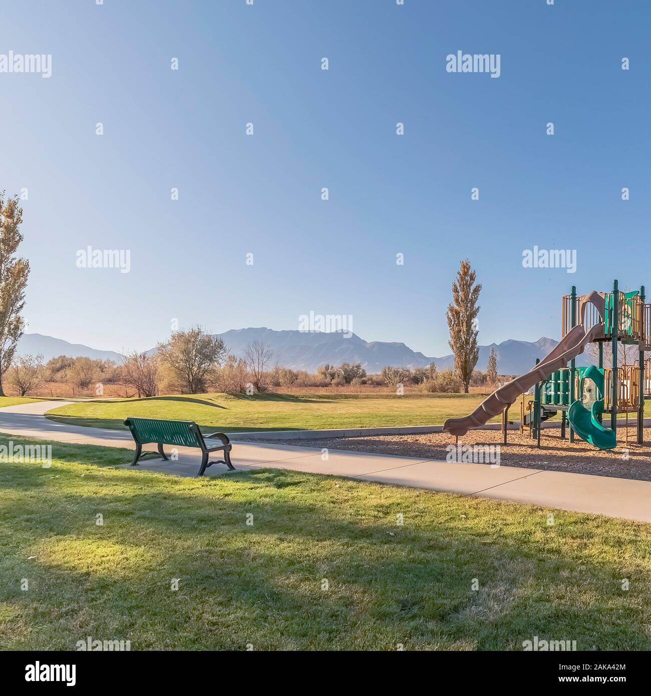Square frame Paved pathway through a neat urban park Stock Photo - Alamy