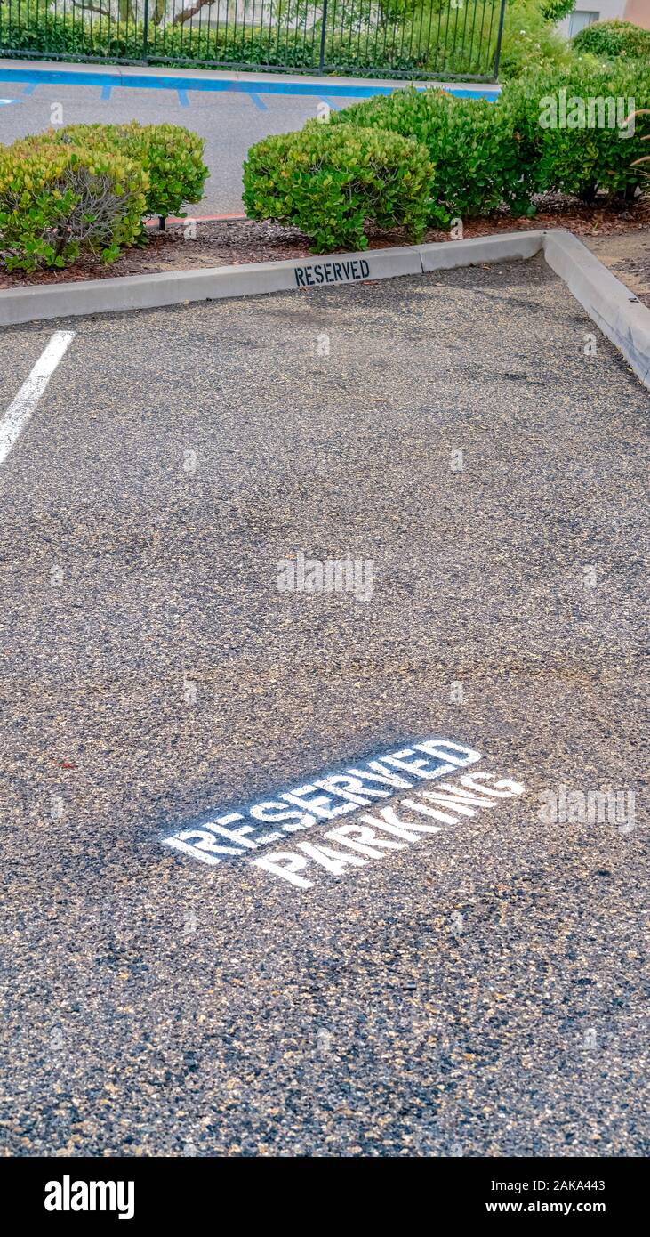 Vertical Reserved Parking sign on a restricted parking bay Stock Photo ...