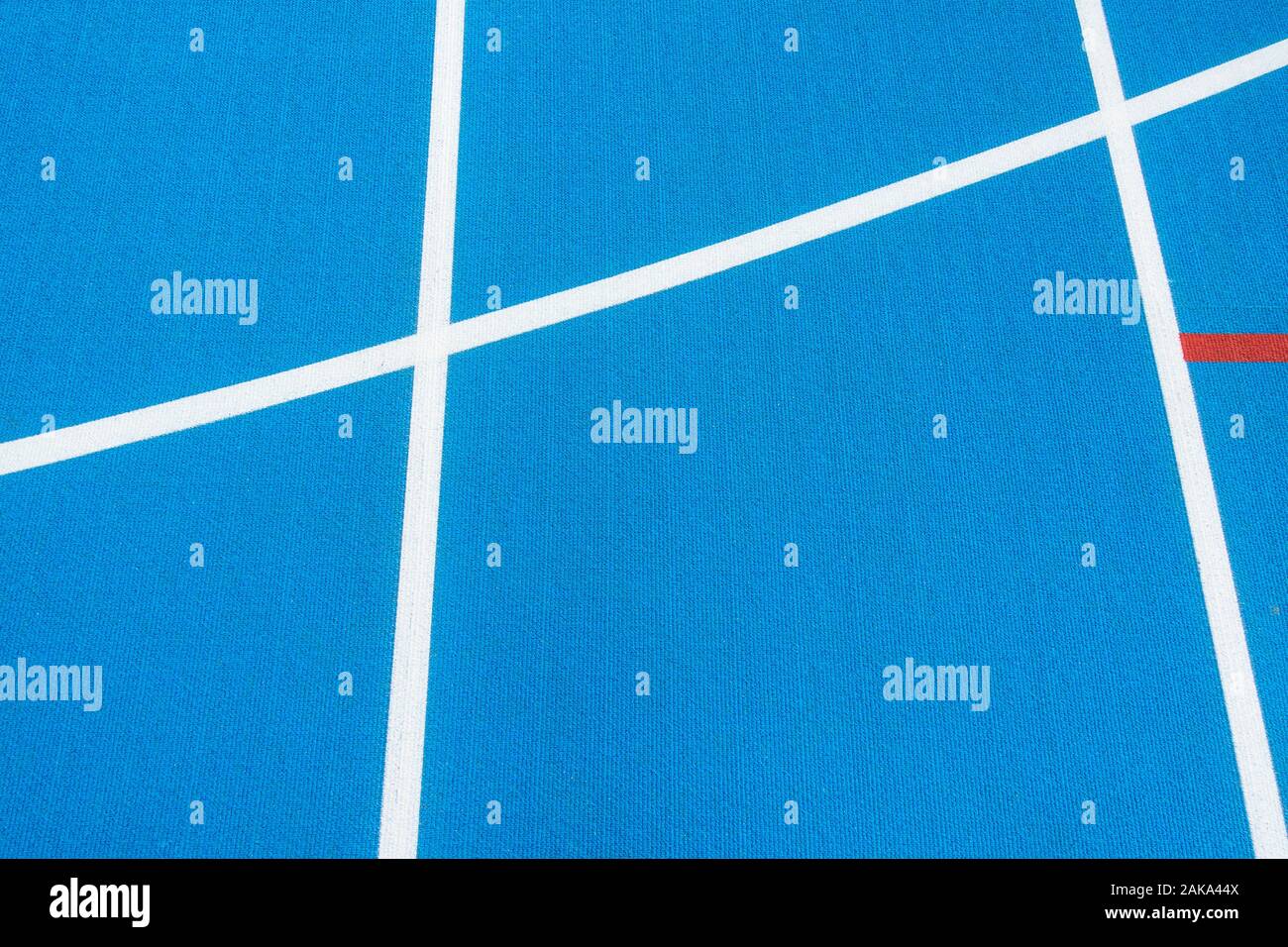 Sport background. Blue running track with white lines in sport stadium ...