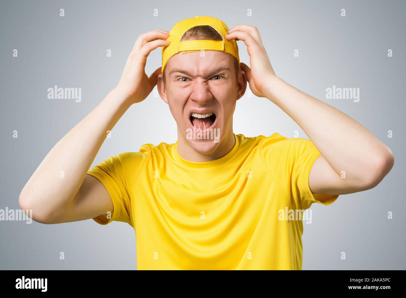 Stressful teenager screaming with panic Stock Photo - Alamy