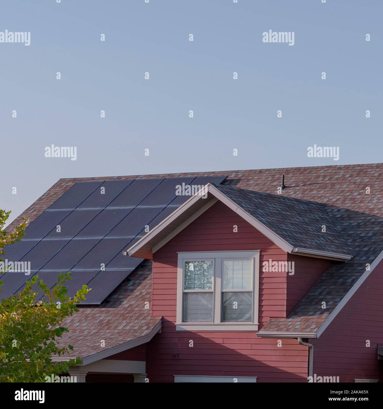 Square Array of photovoltaic solar panels on a roof Stock Photo - Alamy