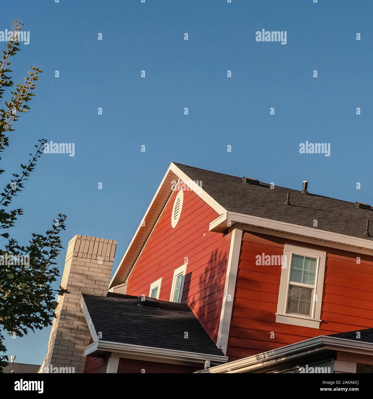 Square Exterior facade of a colorful red house Stock Photo - Alamy
