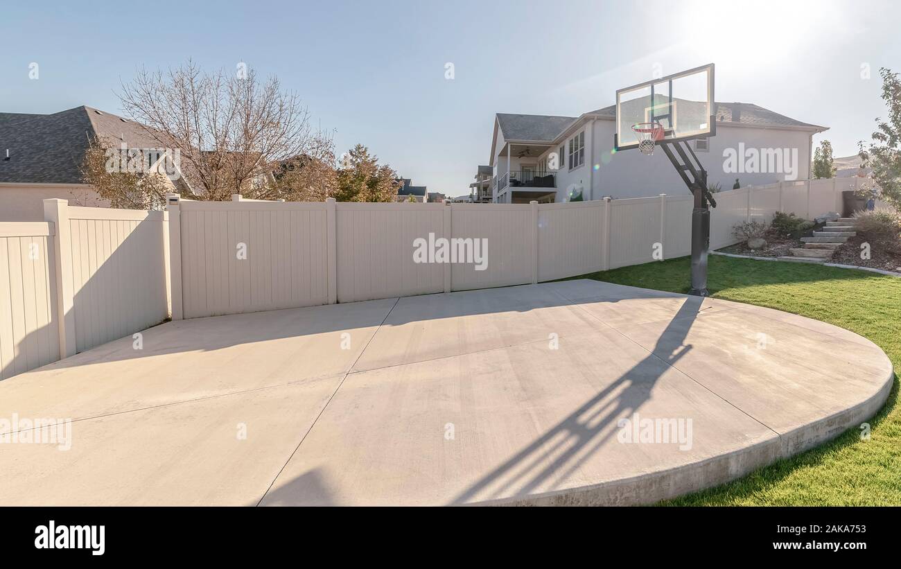 Panorama frame Small all weather practice basketball court on a sunny ...