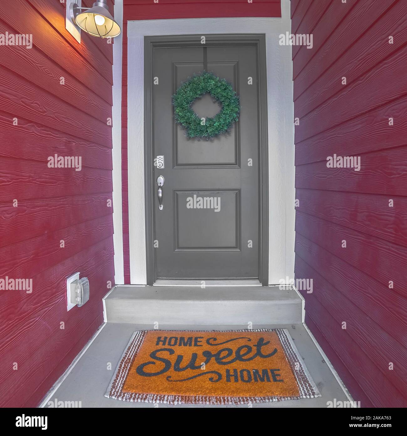 Square frame Entrance door with Home Sweet Home mat Stock Photo - Alamy