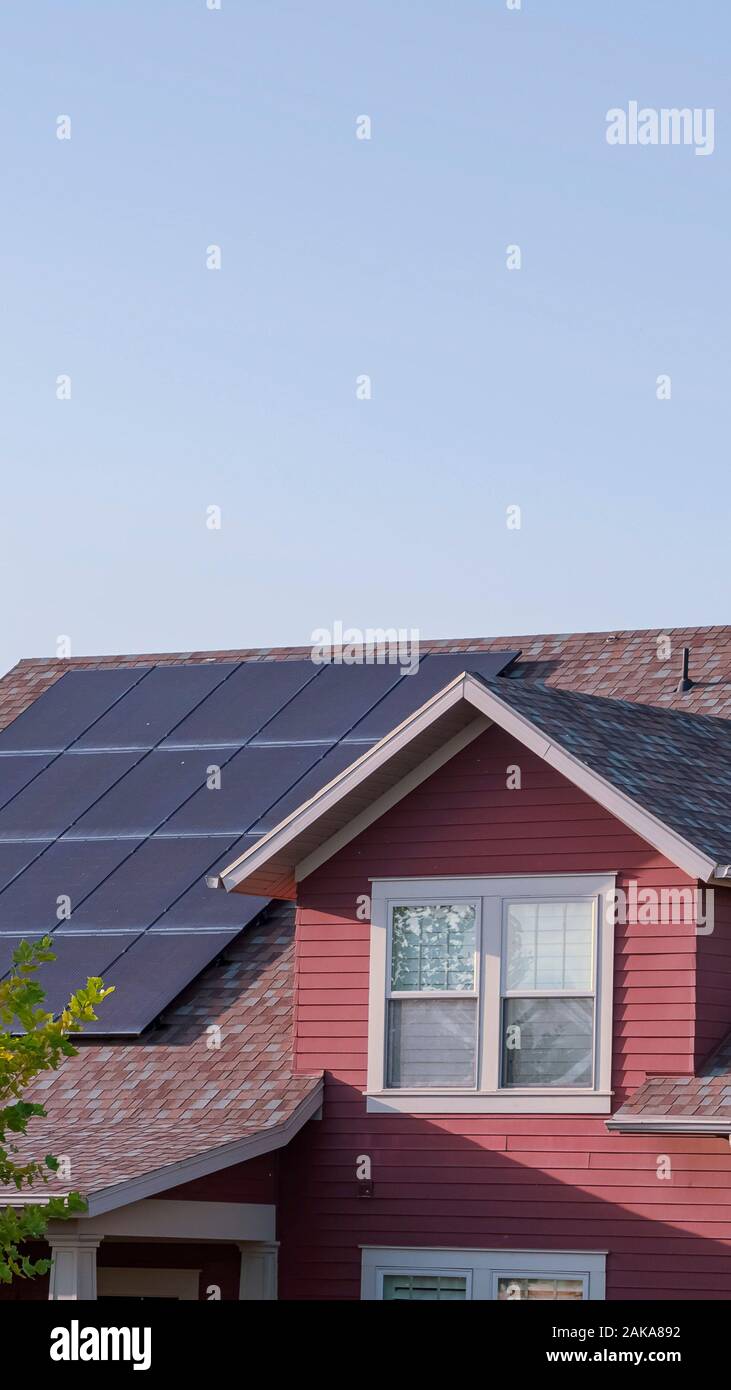 Vertical Array of photovoltaic solar panels on a roof Stock Photo - Alamy