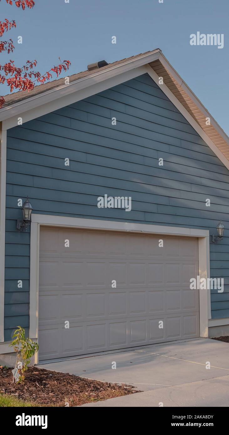 Vertical frame Close double timber clad garage for cars Stock Photo - Alamy