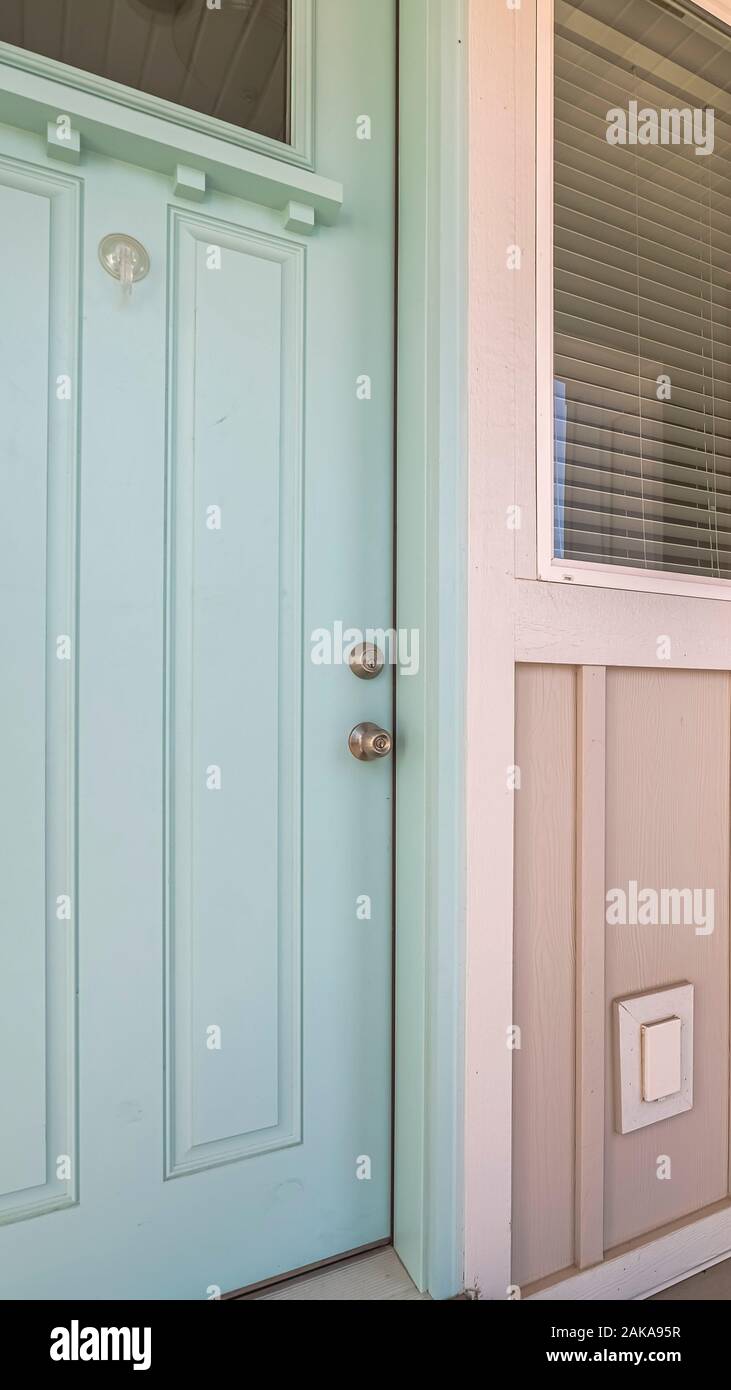 Vertical Green wooden front door with welcome sign Stock Photo - Alamy