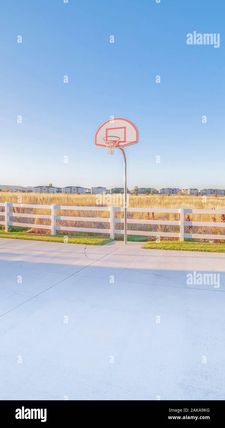 Vertical Empty all weather exterior basketball court on a sunny day ...