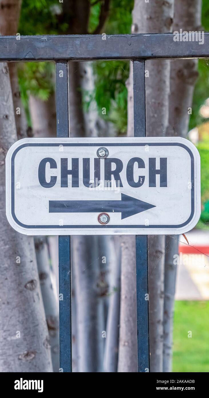Vertical Church sign pointing to the right on a sunny day Stock Photo ...