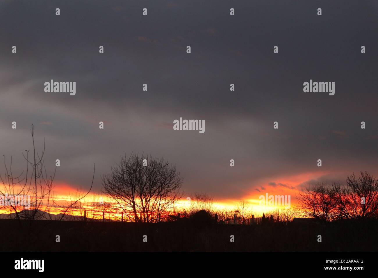Beautiful sunset red and yellow in the nature walk by the village sky ...