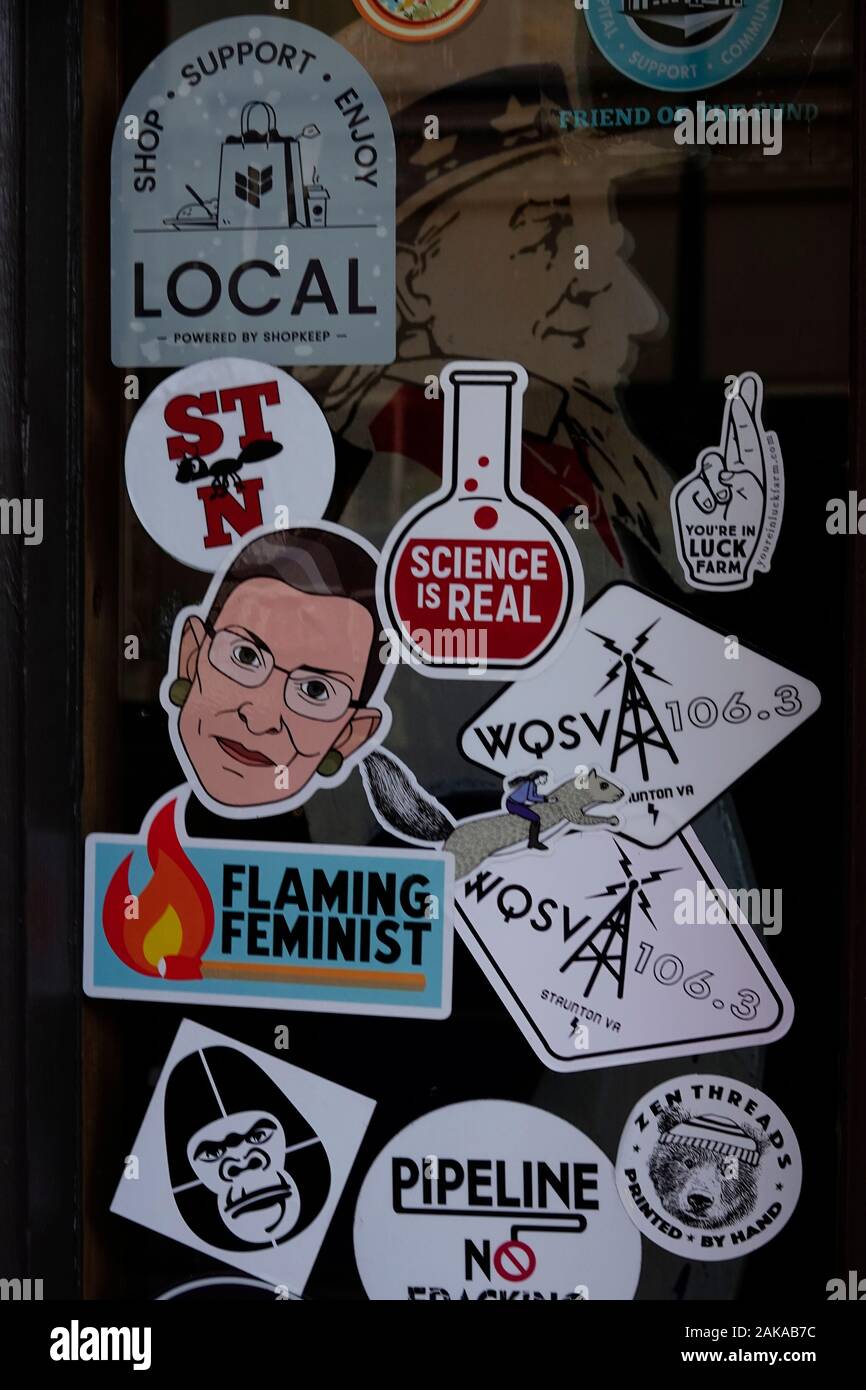 stickers on store window in Staunton Virginia Stock Photo - Alamy