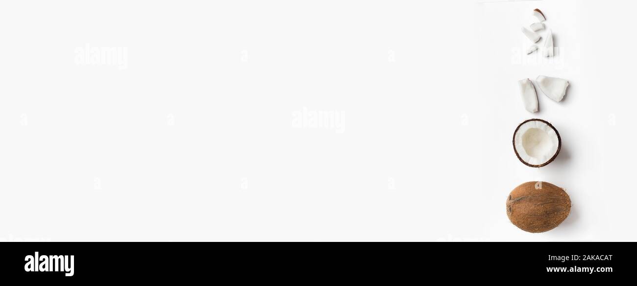 Composition of coconut and coco pieces flat lay on white background ...