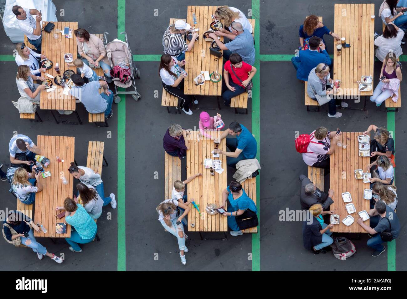 top view of the tables with people eating fast food Stock Photo - Alamy