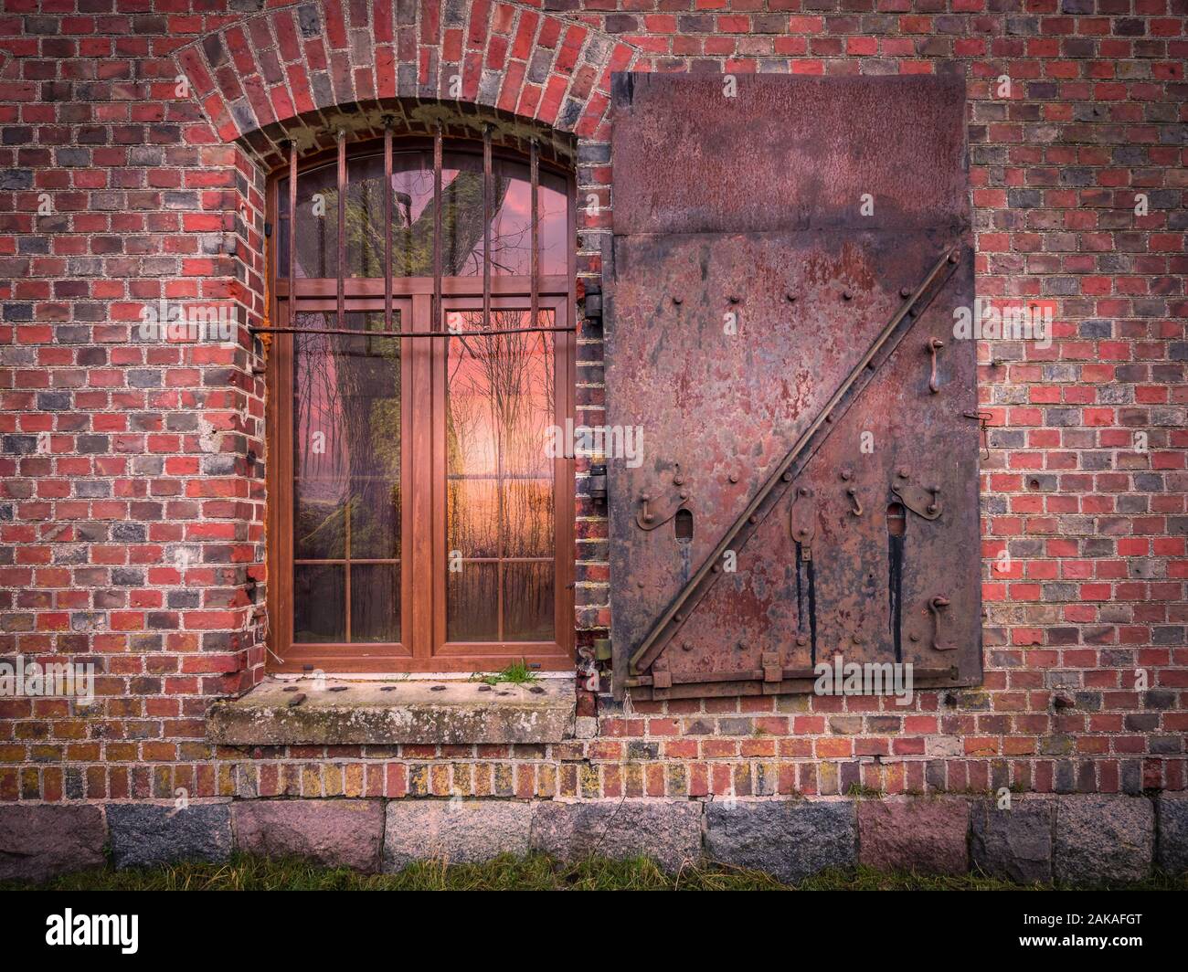 window in brick wall with metal cell Stock Photo - Alamy