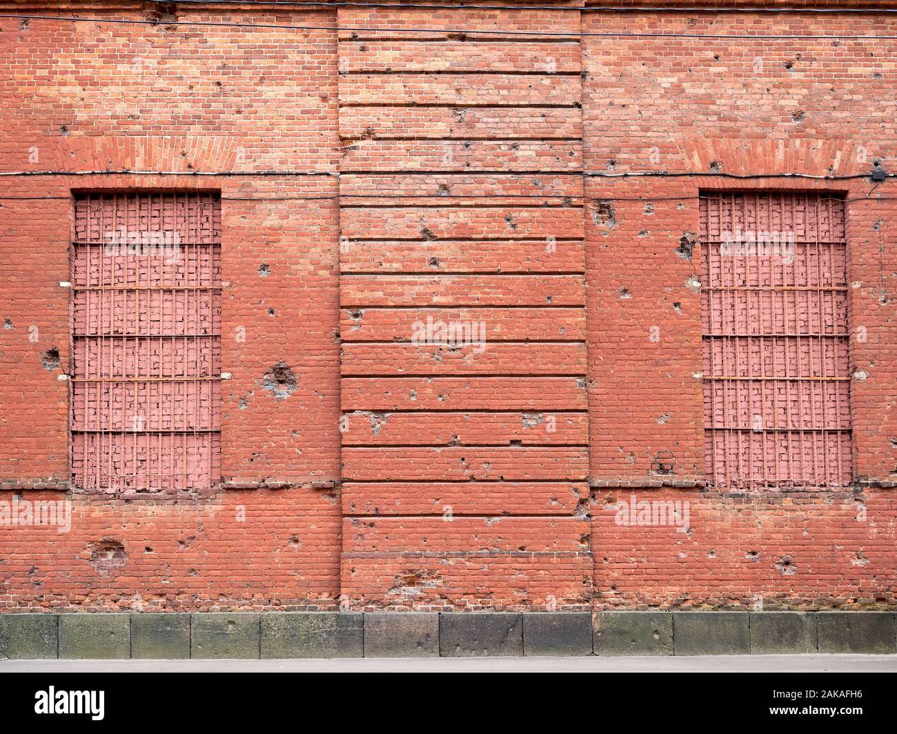 Brick wall with bullet marks Stock Photo - Alamy