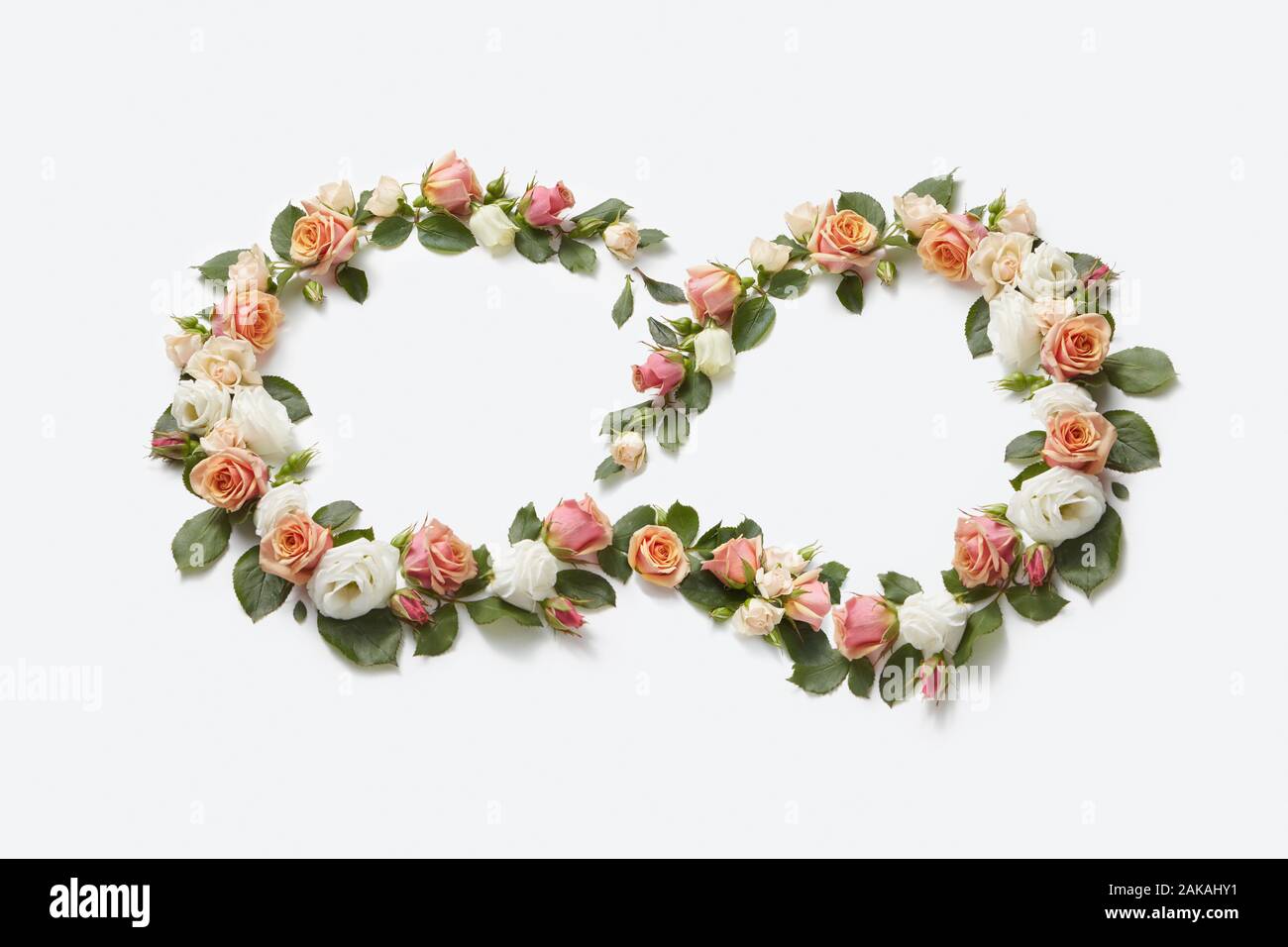 Flowers roses wreath in the shape of figure eight Stock Photo - Alamy