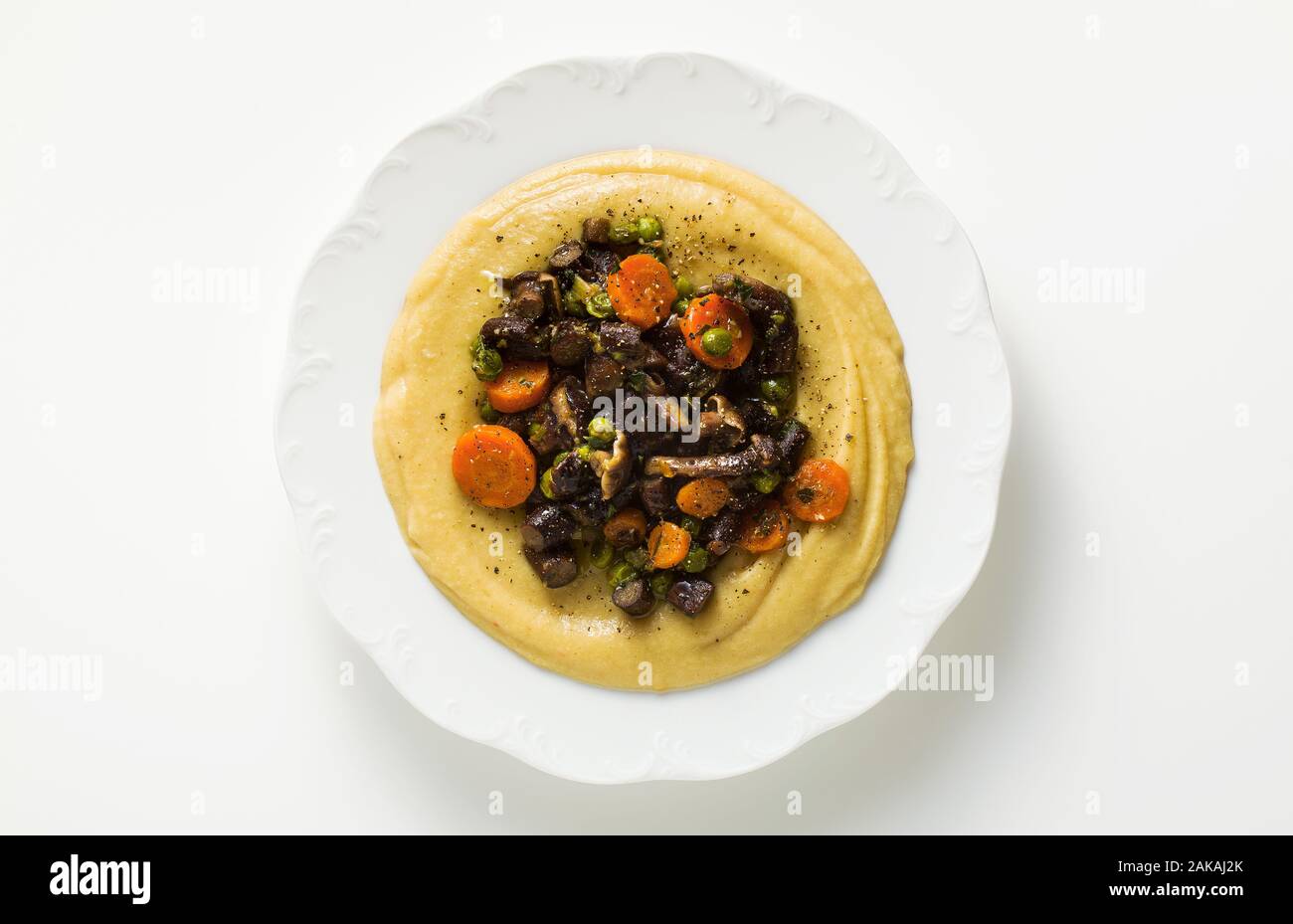 vegetable puree with mushrooms in a plate on the table. healthy cuisine ...