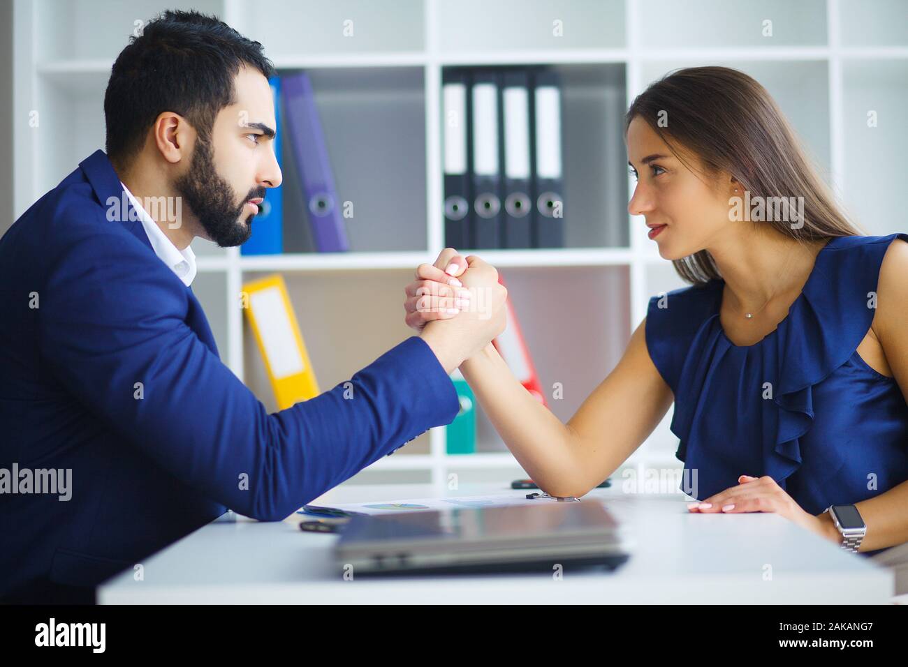 Man and woman staring at each other with hostile expressions Stock ...